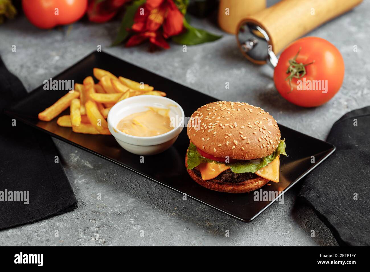 burger with cutlet, cheese and tomatoes. With french fries and burger ...