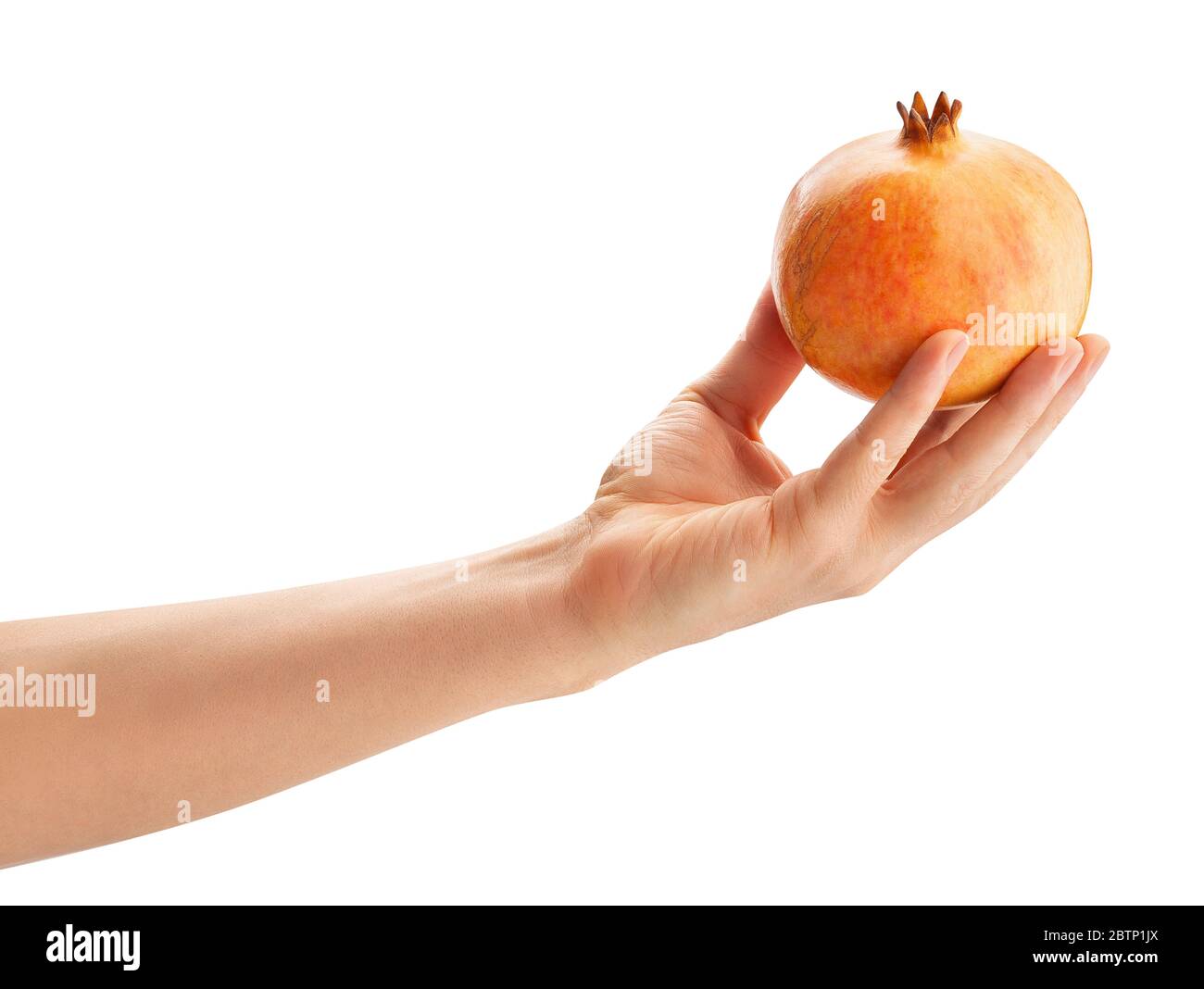 Hand holding pomegranate hi-res stock photography and images - Alamy