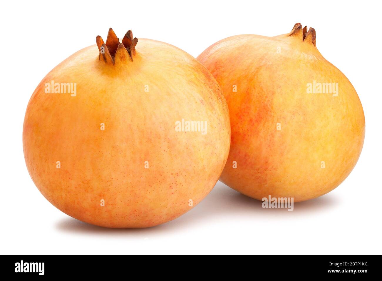 yellow seedless pomegranate path isolated on white Stock Photo - Alamy