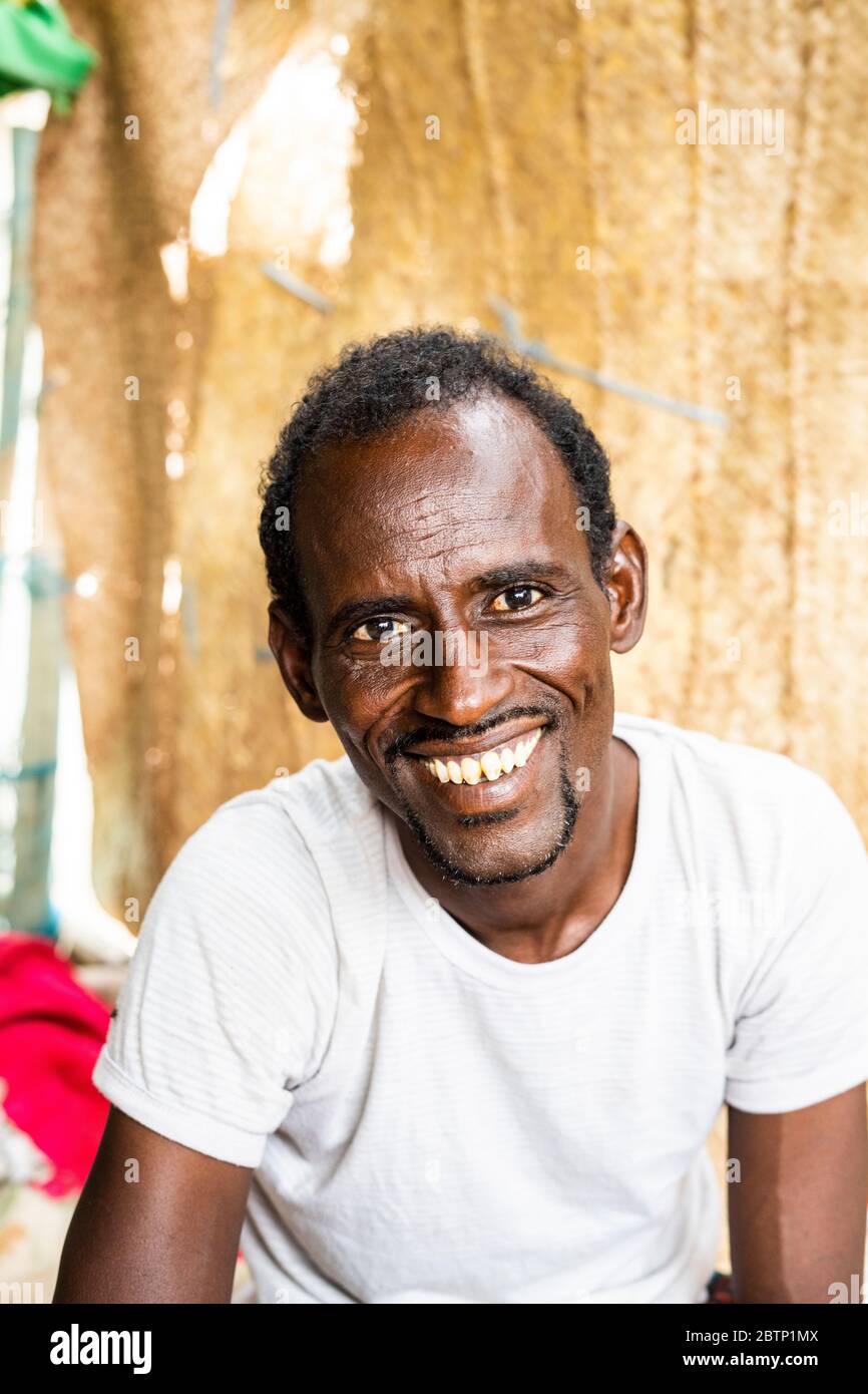 African man and hut hi-res stock photography and images - Alamy