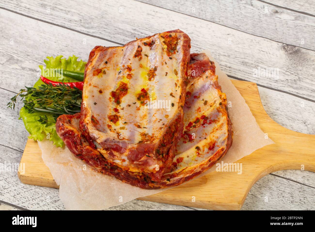Marinated Raw pork ribs for grill Stock Photo - Alamy