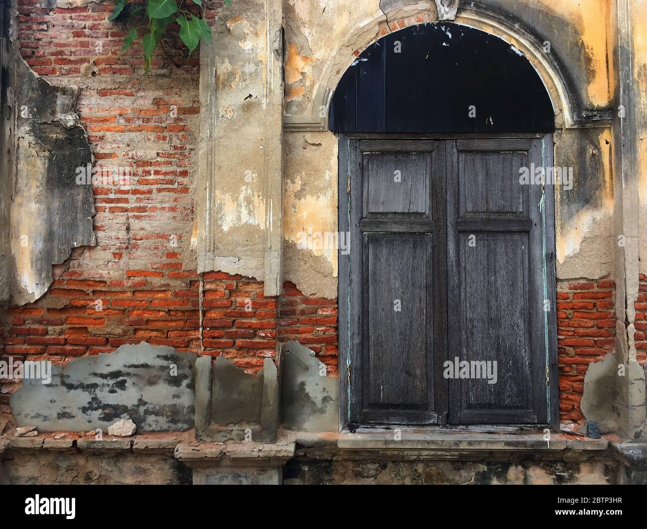 old door and window of brick building Stock Photo - Alamy