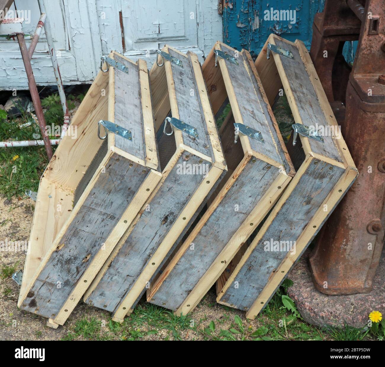 Homemade new wooden boxes with steel mesh for sifting sand in a rural ...