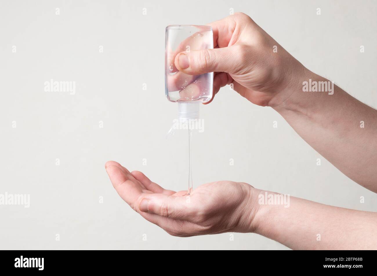 Using a sanitizer hi-res stock photography and images - Alamy