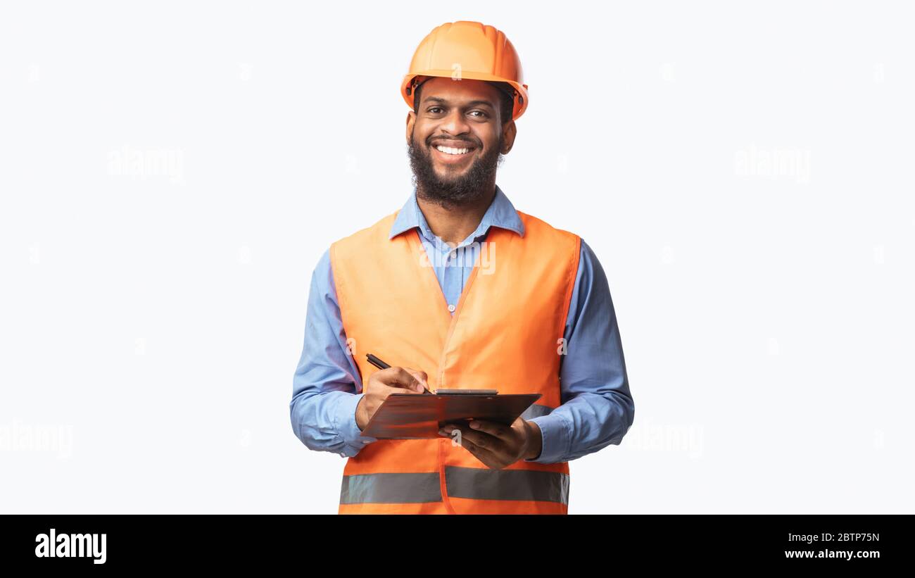 Happy Construction Worker Guy Taking Notes Holding Folder, Studio Shot ...