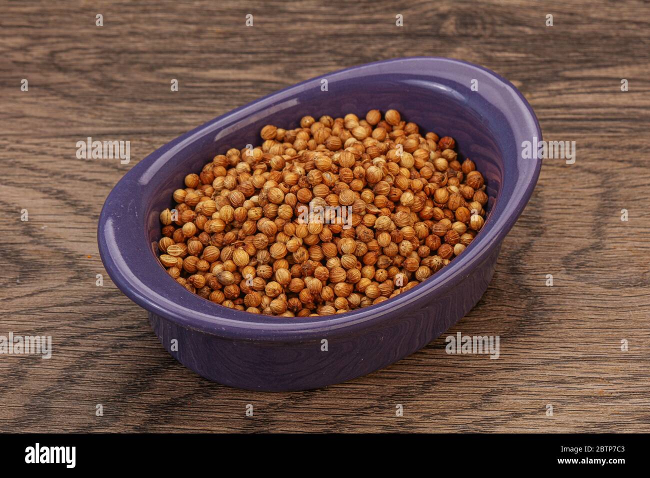 Dry Coriander seeds in the bowl Stock Photo - Alamy