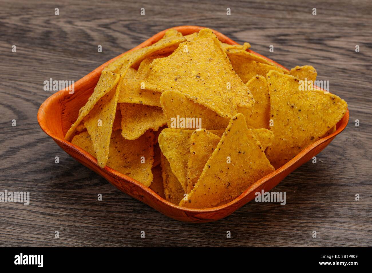 Mexican crunchy corn nachos triangle heap Stock Photo - Alamy