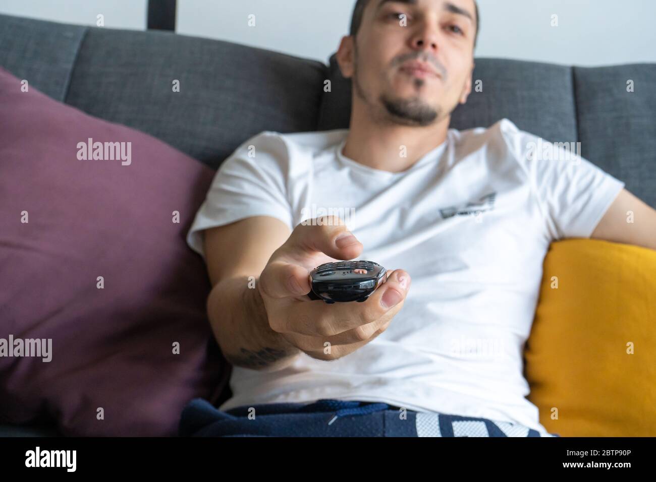 Man watching tv in a modern home hi-res stock photography and images ...