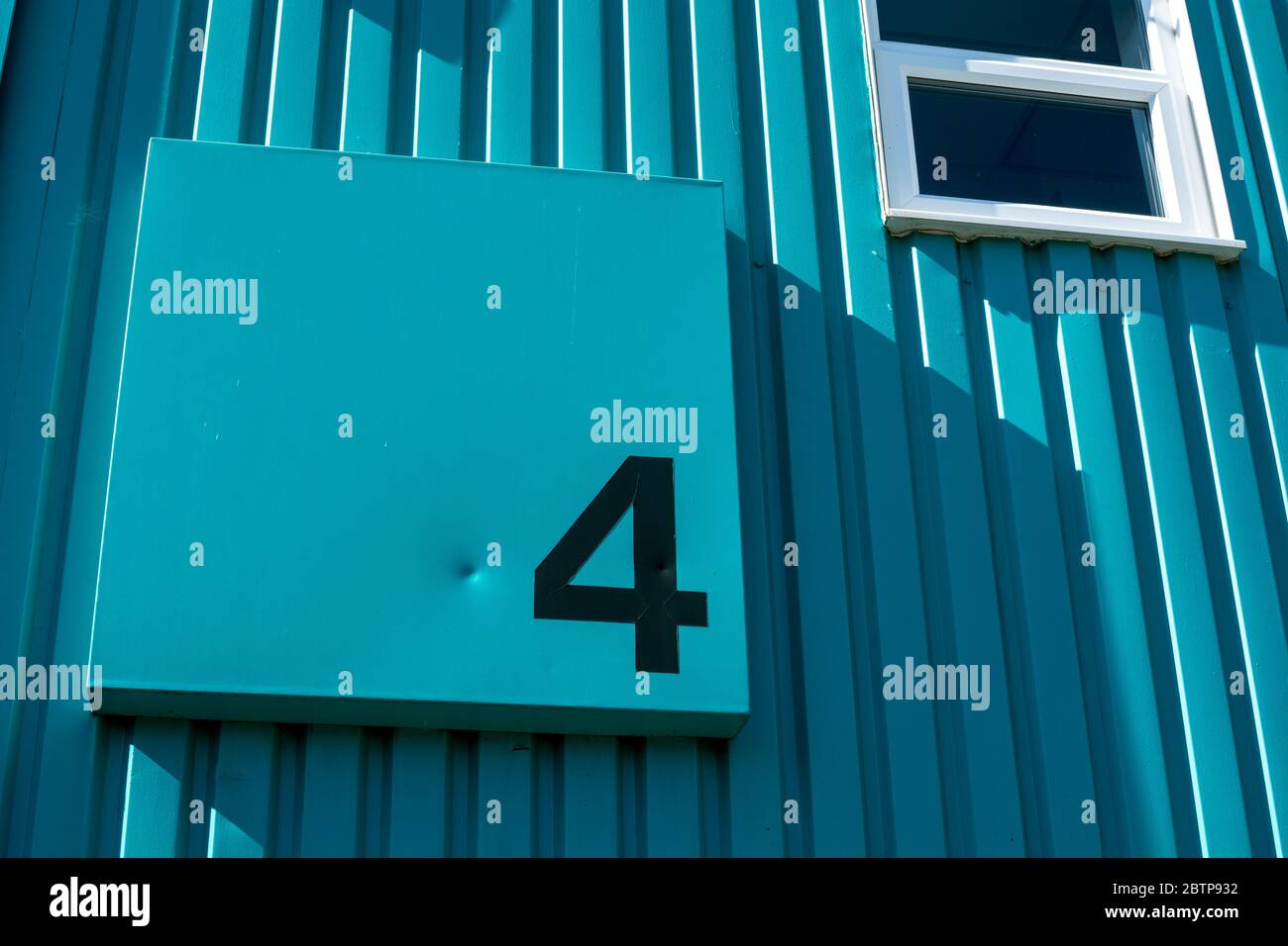 A number 4 on a small factory building, Warwick, UK Stock Photo - Alamy