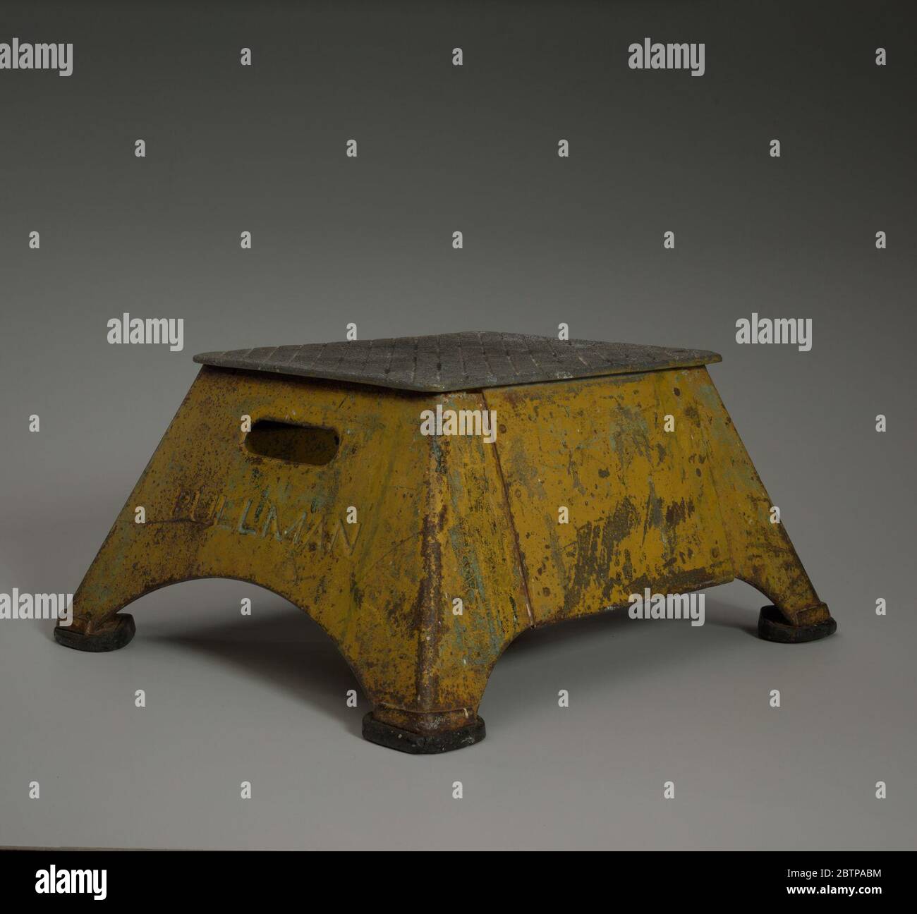 Platform step stool used by Pullman Palace Car Company. A yellow, metal ...