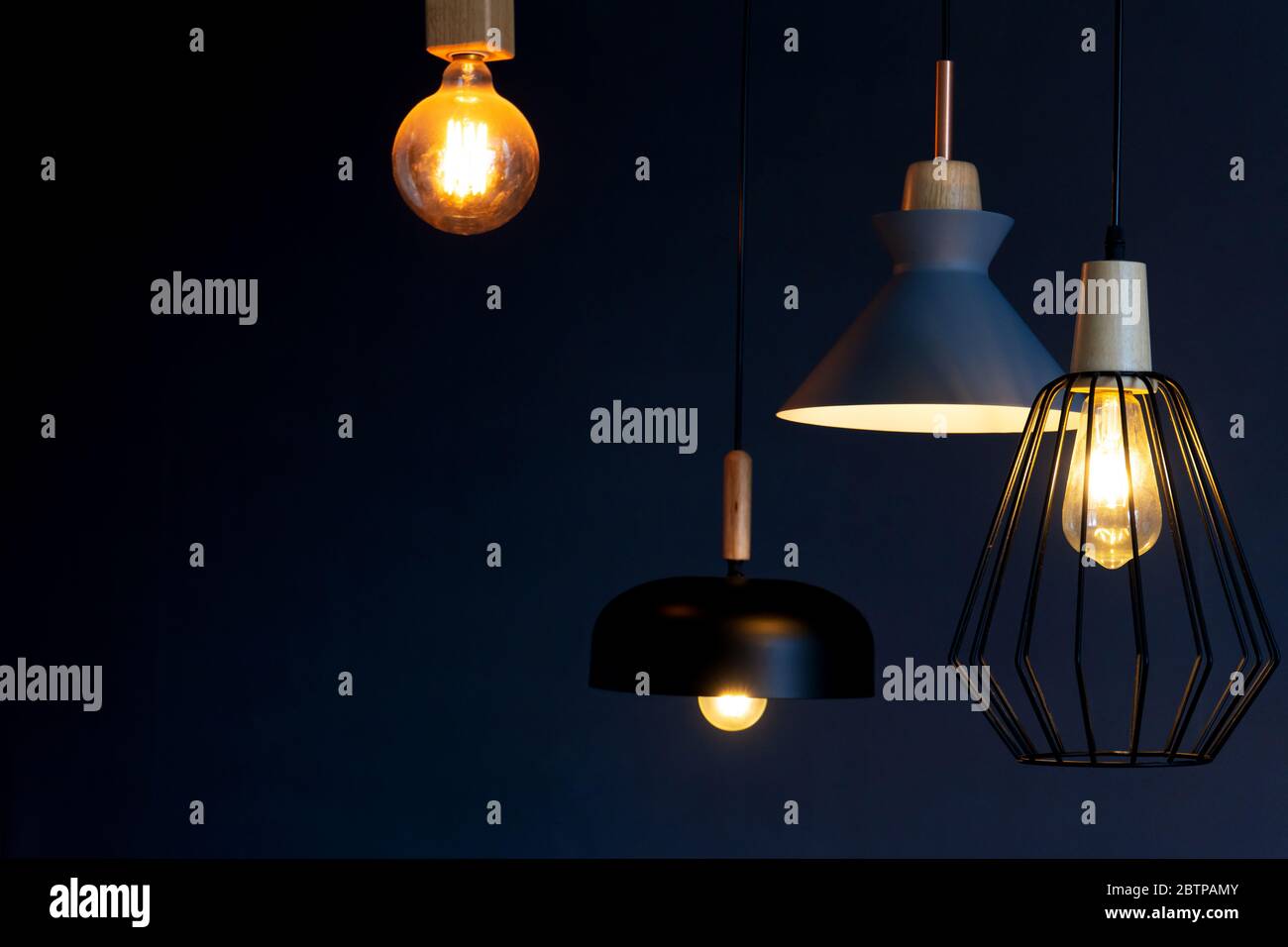 Interior decoration of stylish housing. Loft style incandescent lamp ...