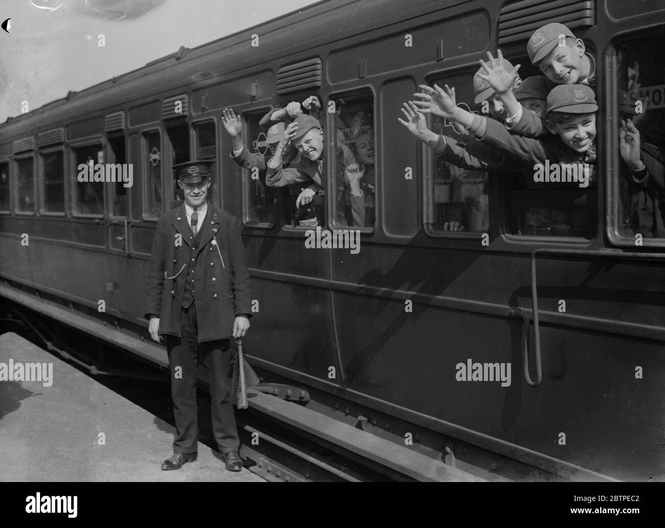 Schoolboys travelling by train . 1935 Stock Photo - Alamy