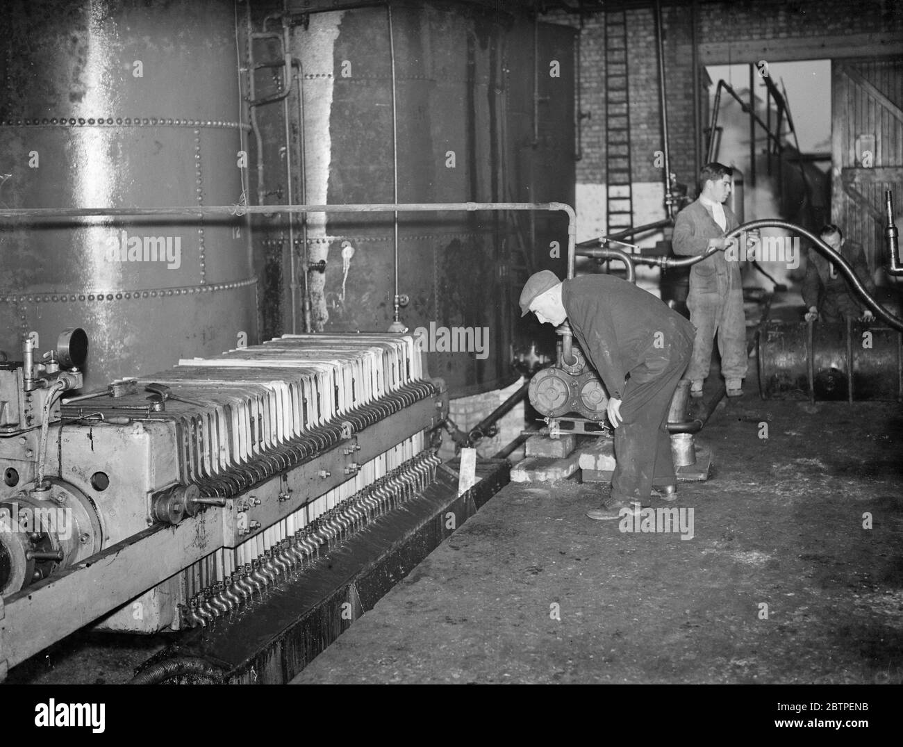 Refining oil . 1938 Stock Photo - Alamy