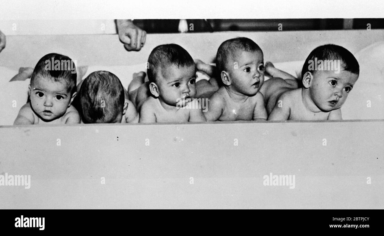 Dionne Quins . all the quins sitting up and talking Stock Photo - Alamy