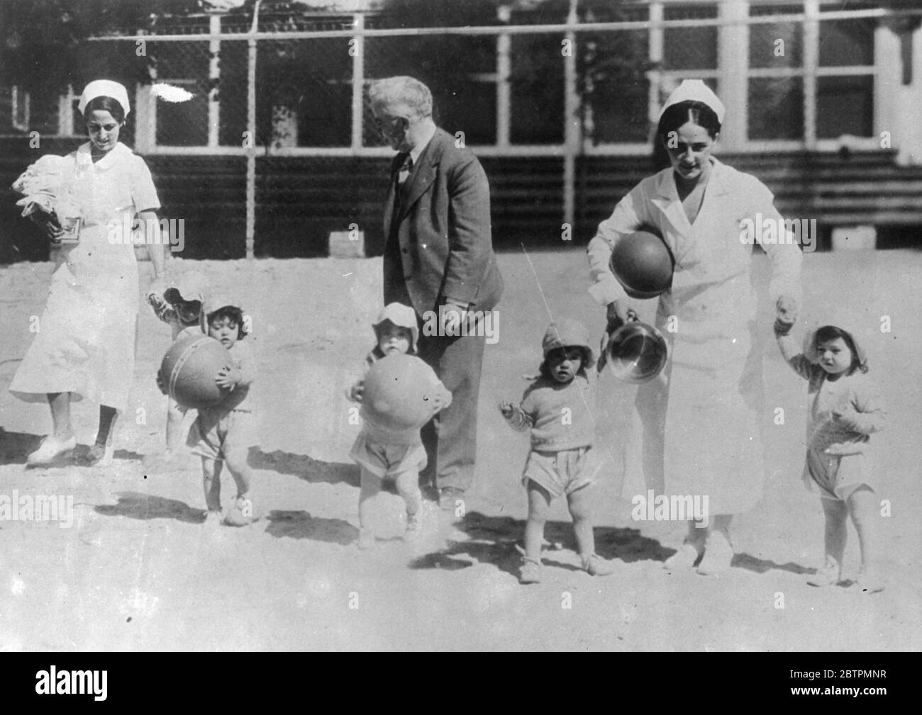 Dionnes . All set for play in the wading pool . Left to right , Annette ...