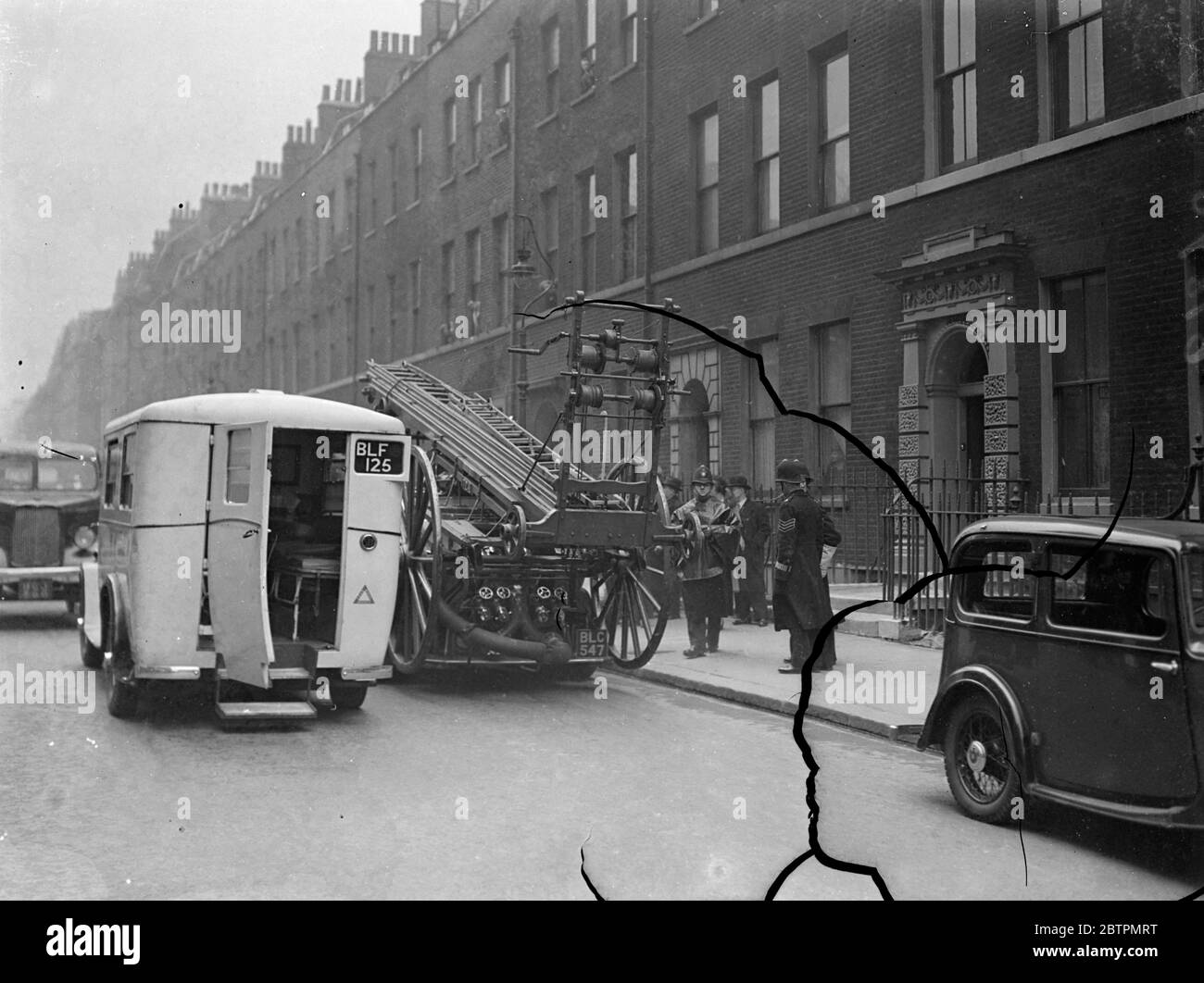 Fire engine and ambulance. February 1937 Stock Photo - Alamy