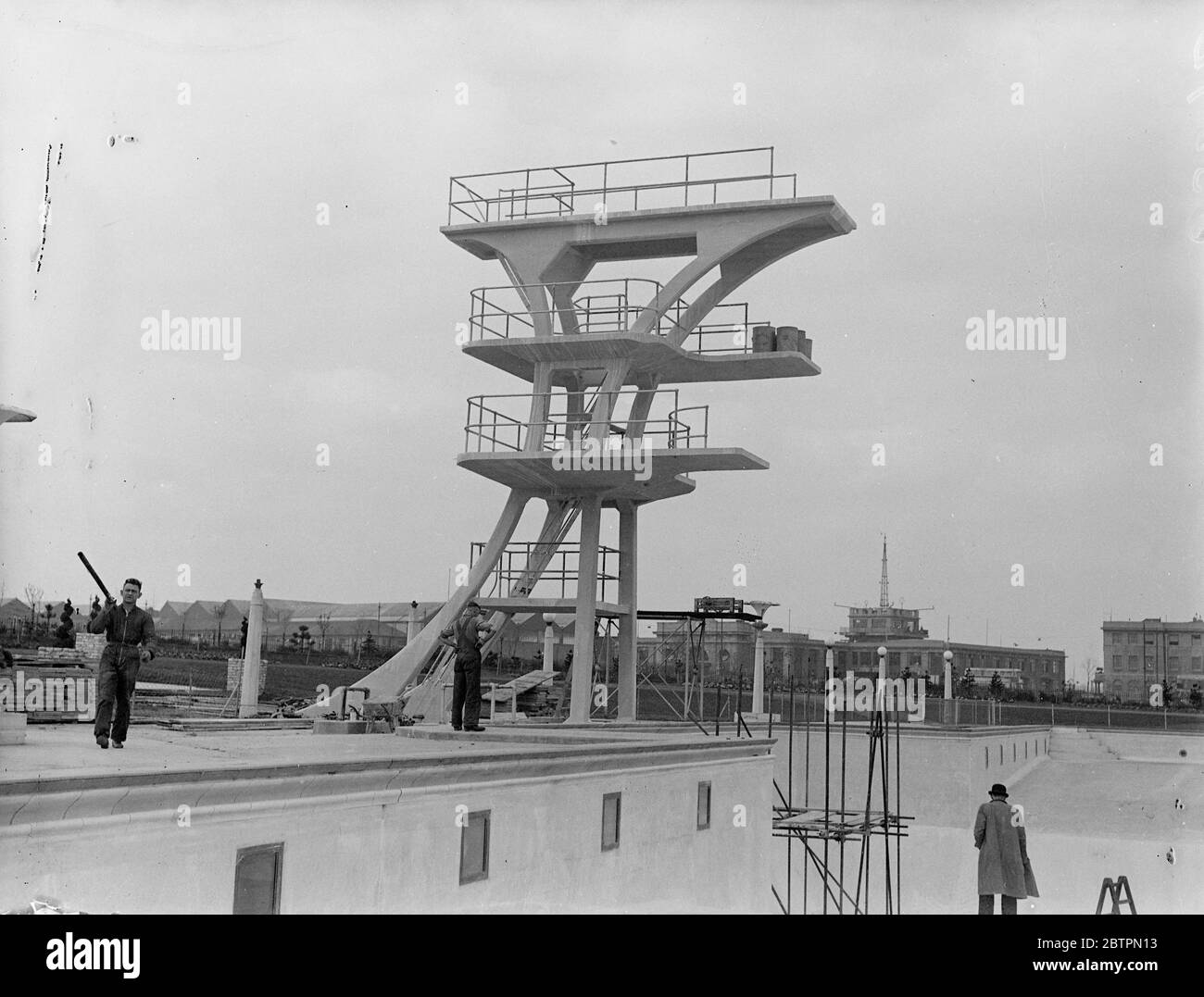 High divers near high flyers. Photo shows: the new high diving stage ...