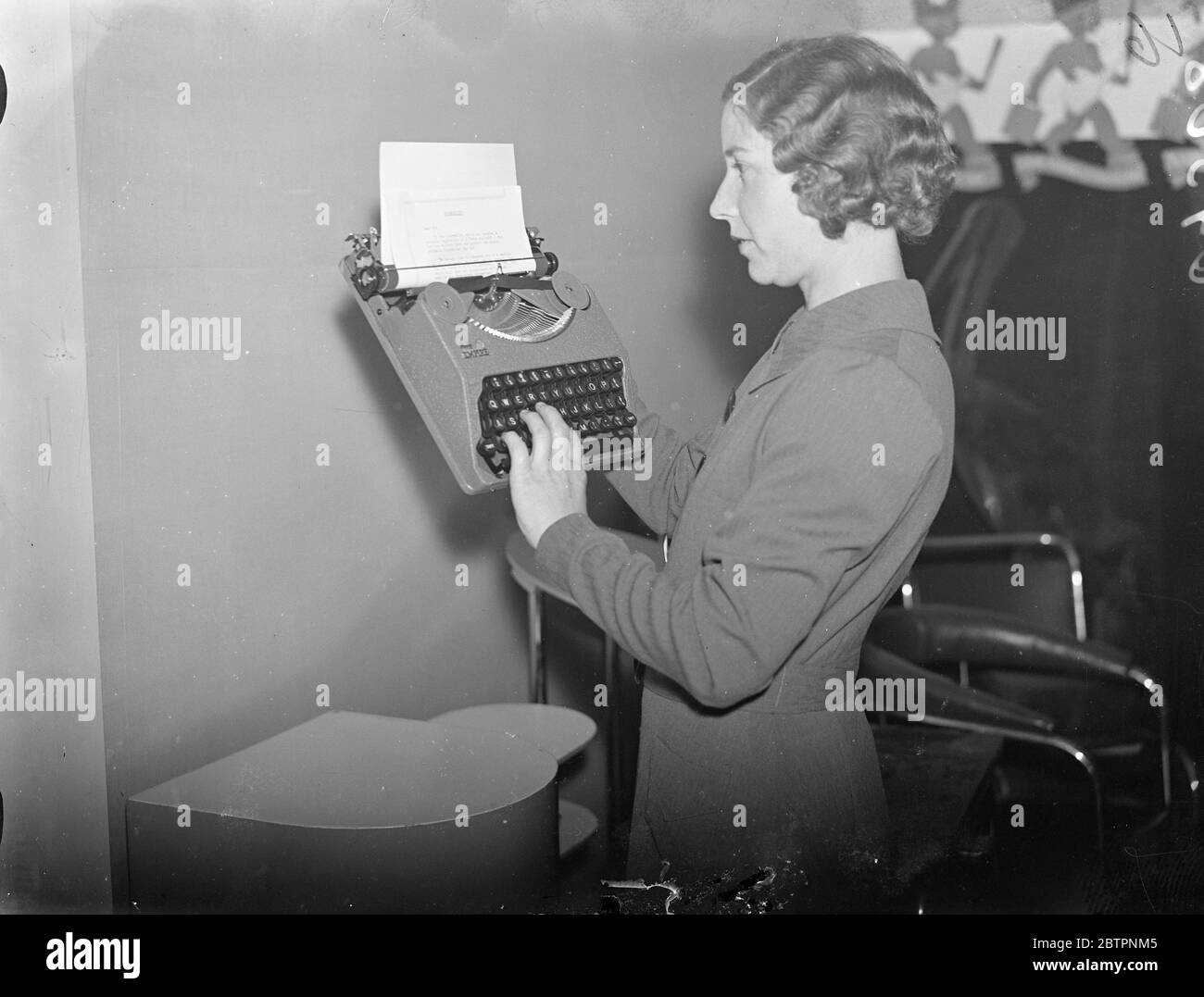 World's smallest four bank type writer, at business efficiency ...