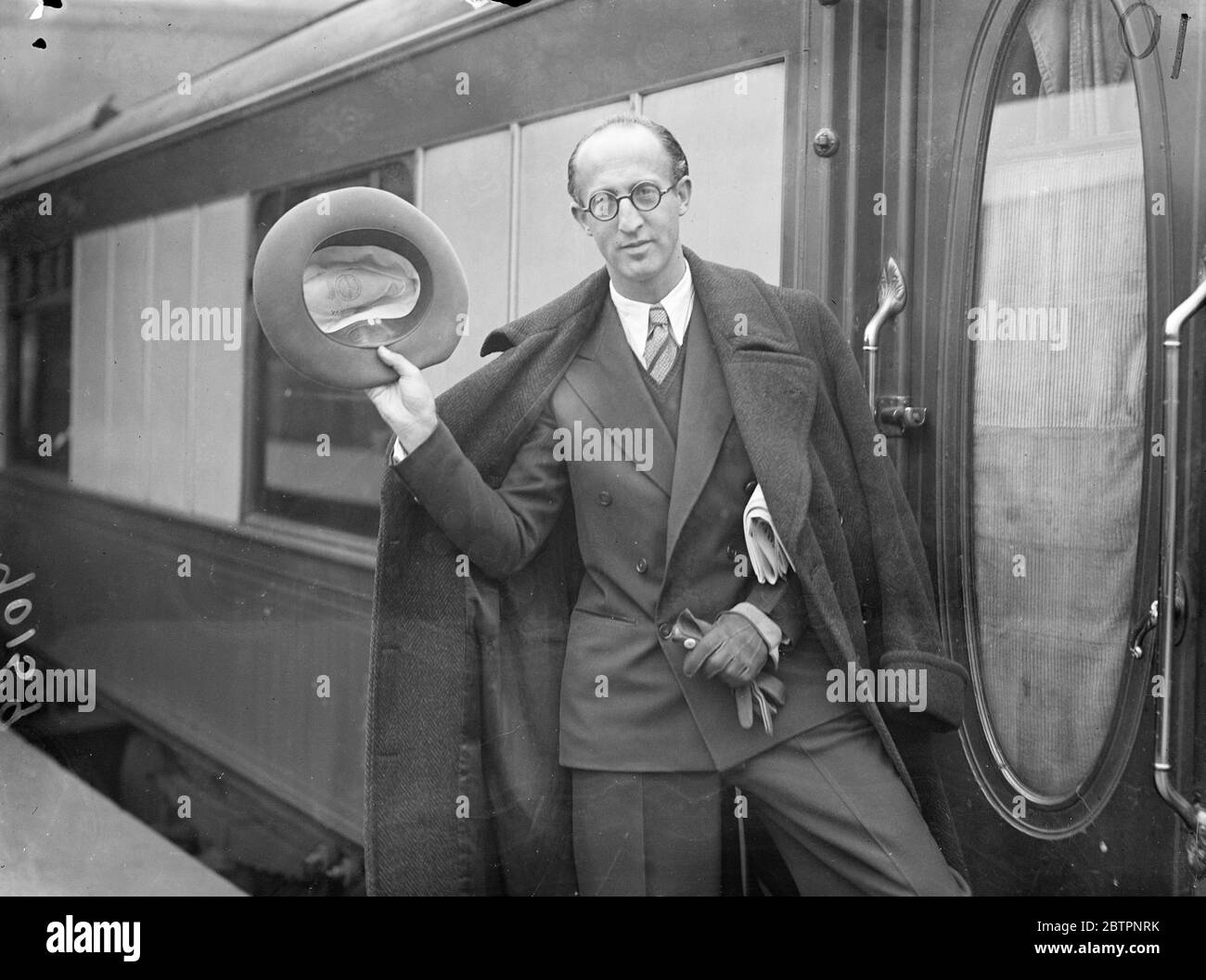 No caption Man waving at train station 2 September 1937 Stock Photo - Alamy