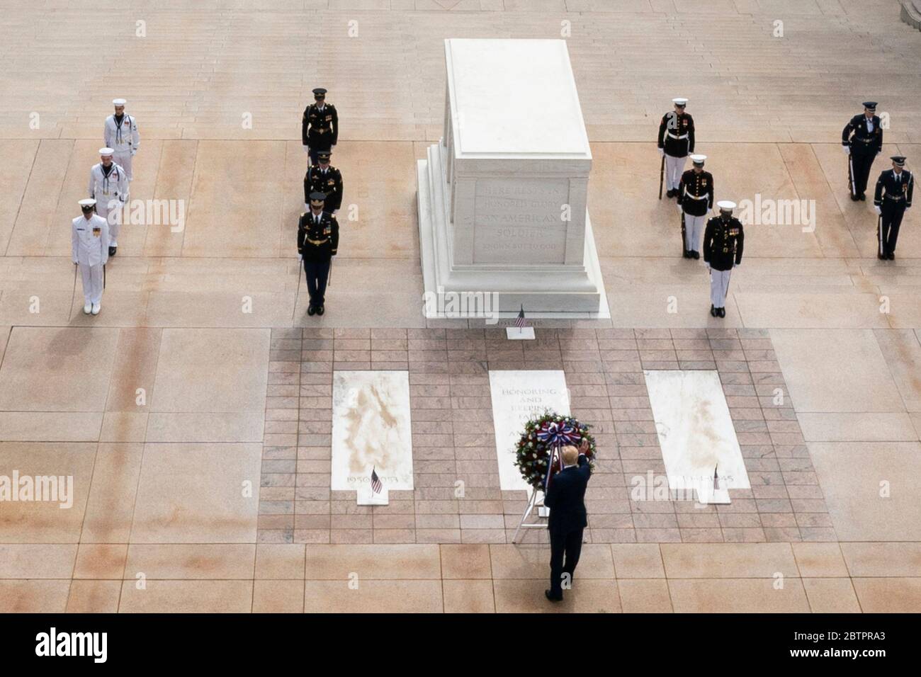 U.S. President Donald Trump touches the wreath during the Presidential ...