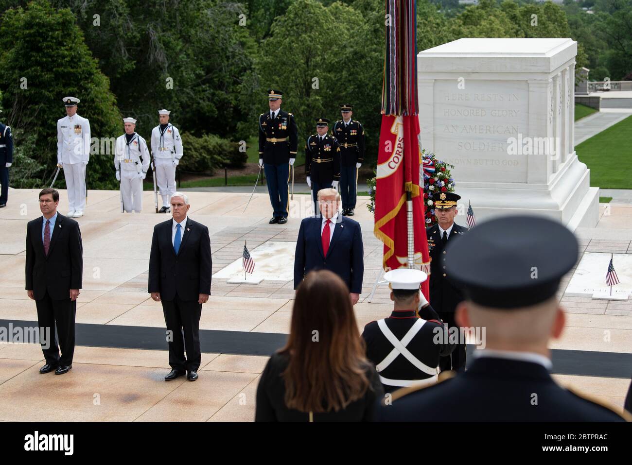 U.S. President Donald Trump stands for a moment of silence during the ...