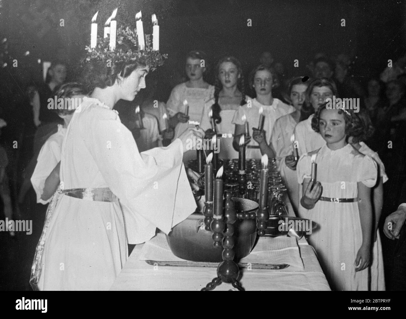 Swedes celebrate St Lucia's day. Crown of lighting candles. The Swedish ...