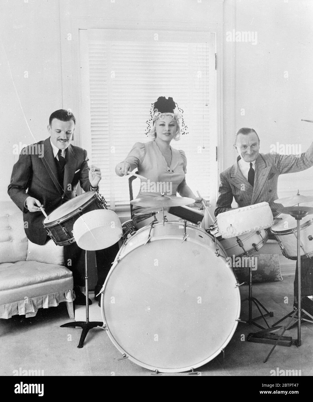 Mae West beats the drum. May organise her own band. Mae West, the film ...