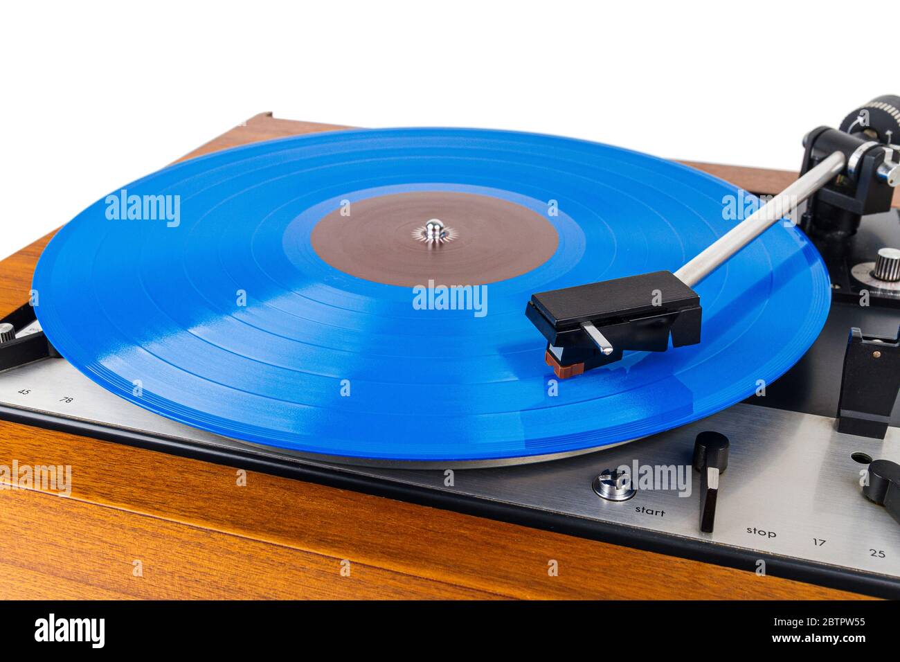 Vintage turntable with a blue vinyl isolated on white. Wooden plinth ...