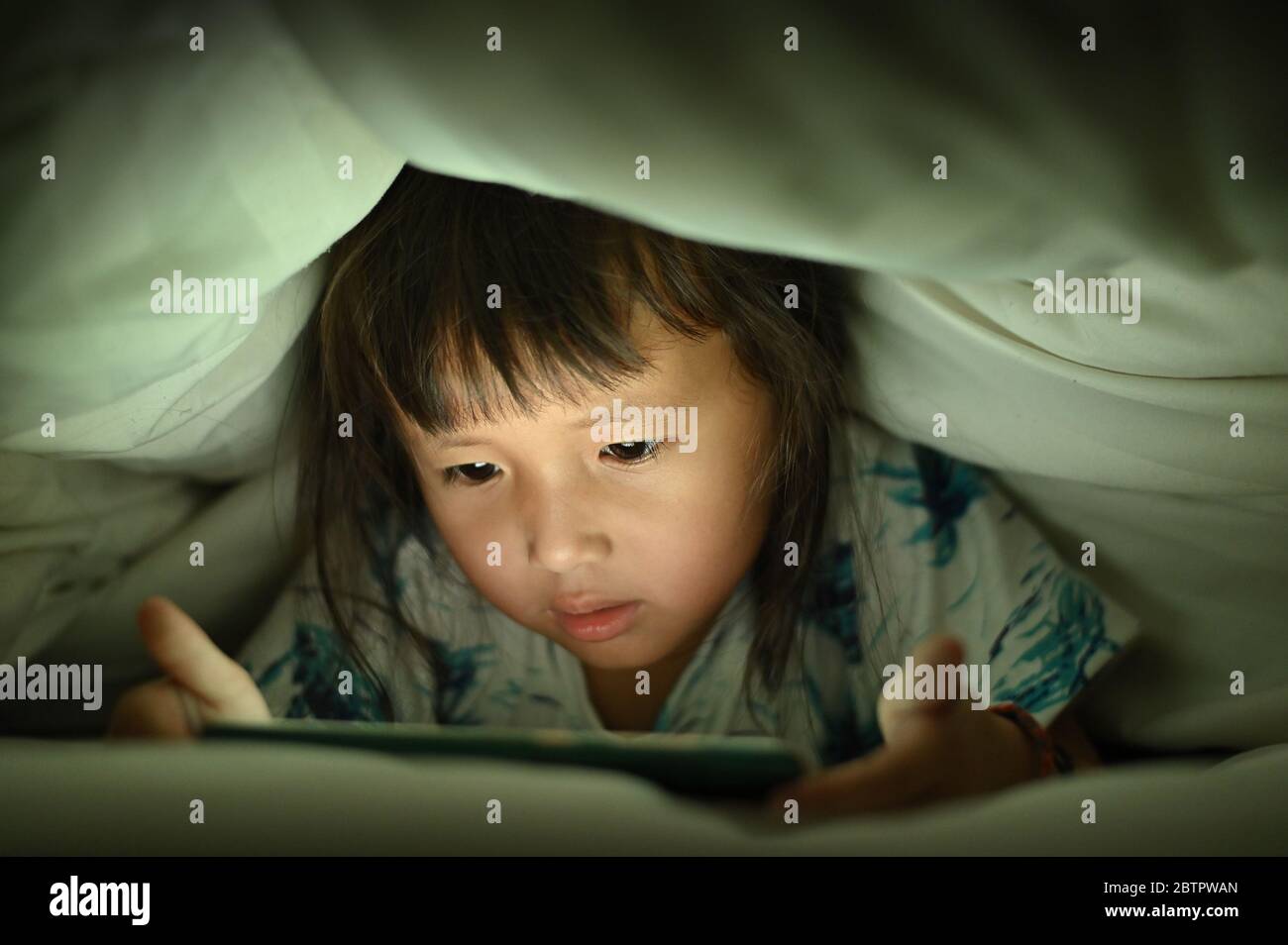 Child watching cartoons hi-res stock photography and images - Alamy