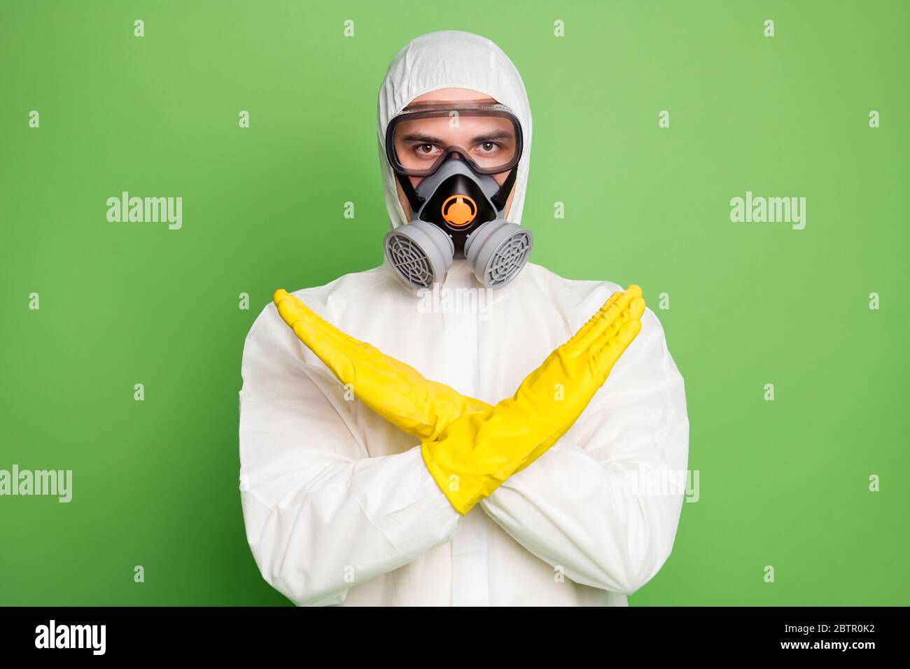 Close-up portrait of his he nice serious disinfectant wearing gas mask ...