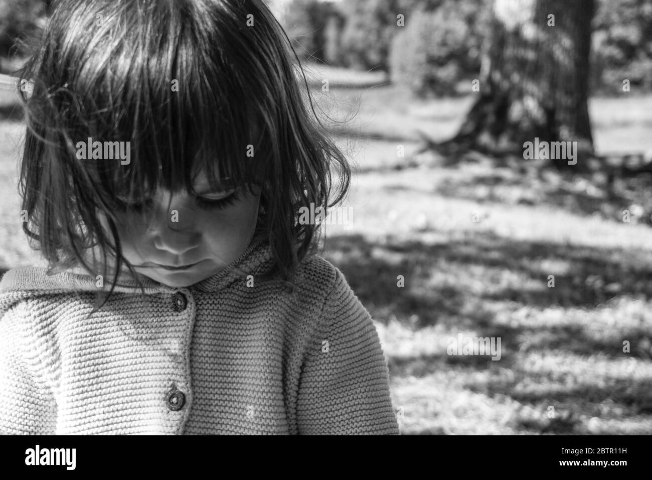 Child sad looking down hi-res stock photography and images - Alamy
