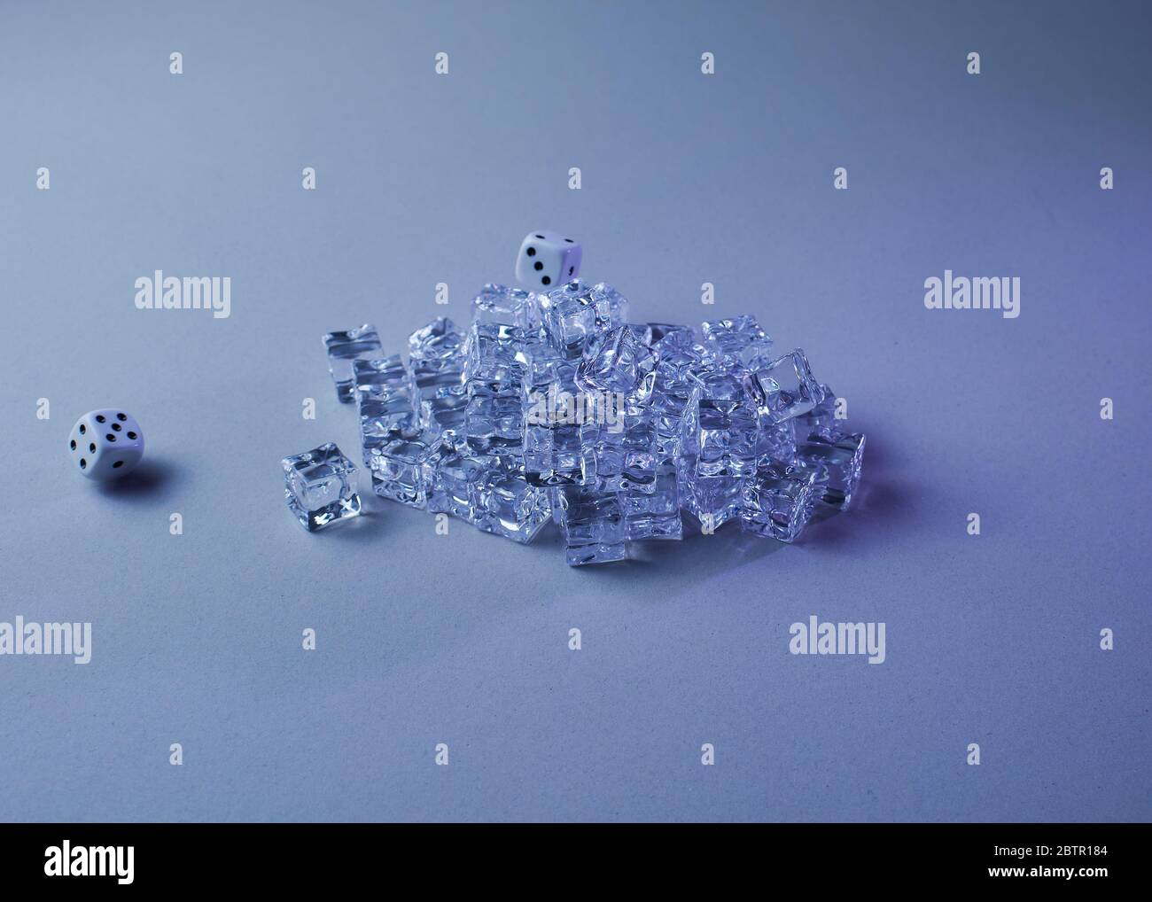 Set of ice cubes and dice falling on them, gray background, chaos Stock ...