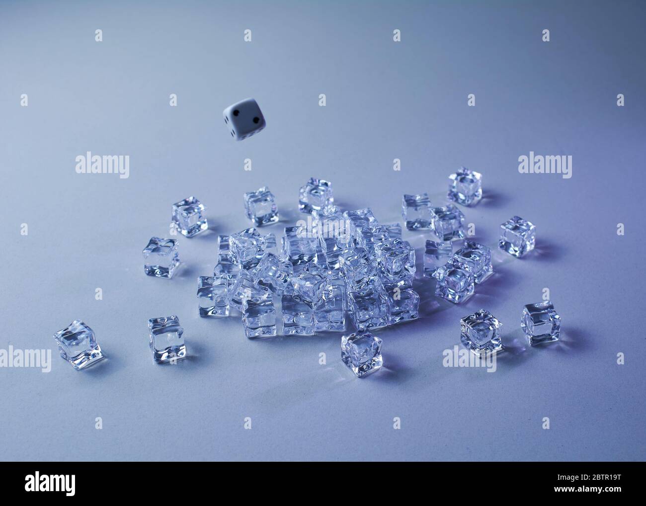 Set of ice cubes and dice falling on them, gray background, chaos Stock ...