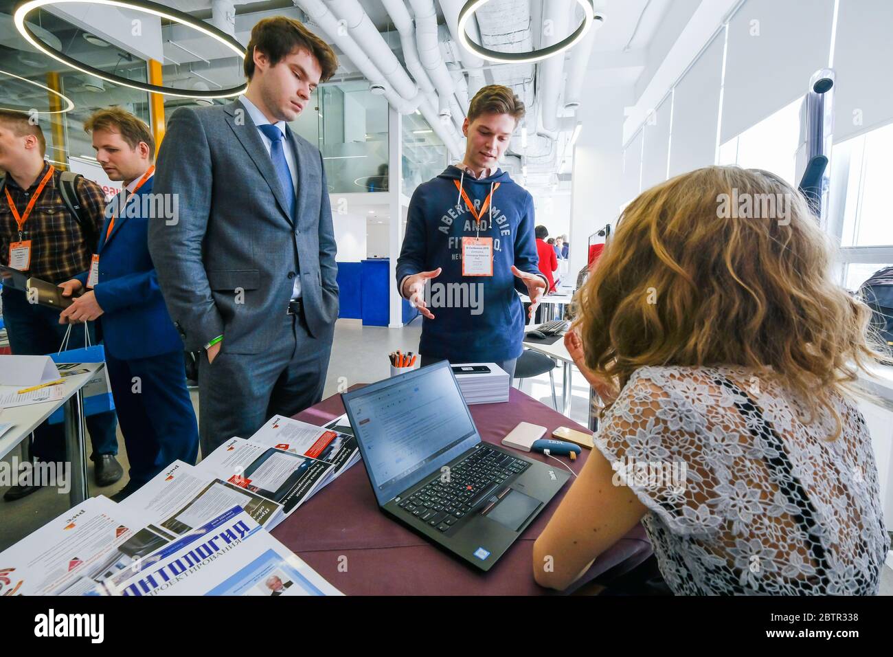 Conference visitors converse at hall Stock Photo - Alamy