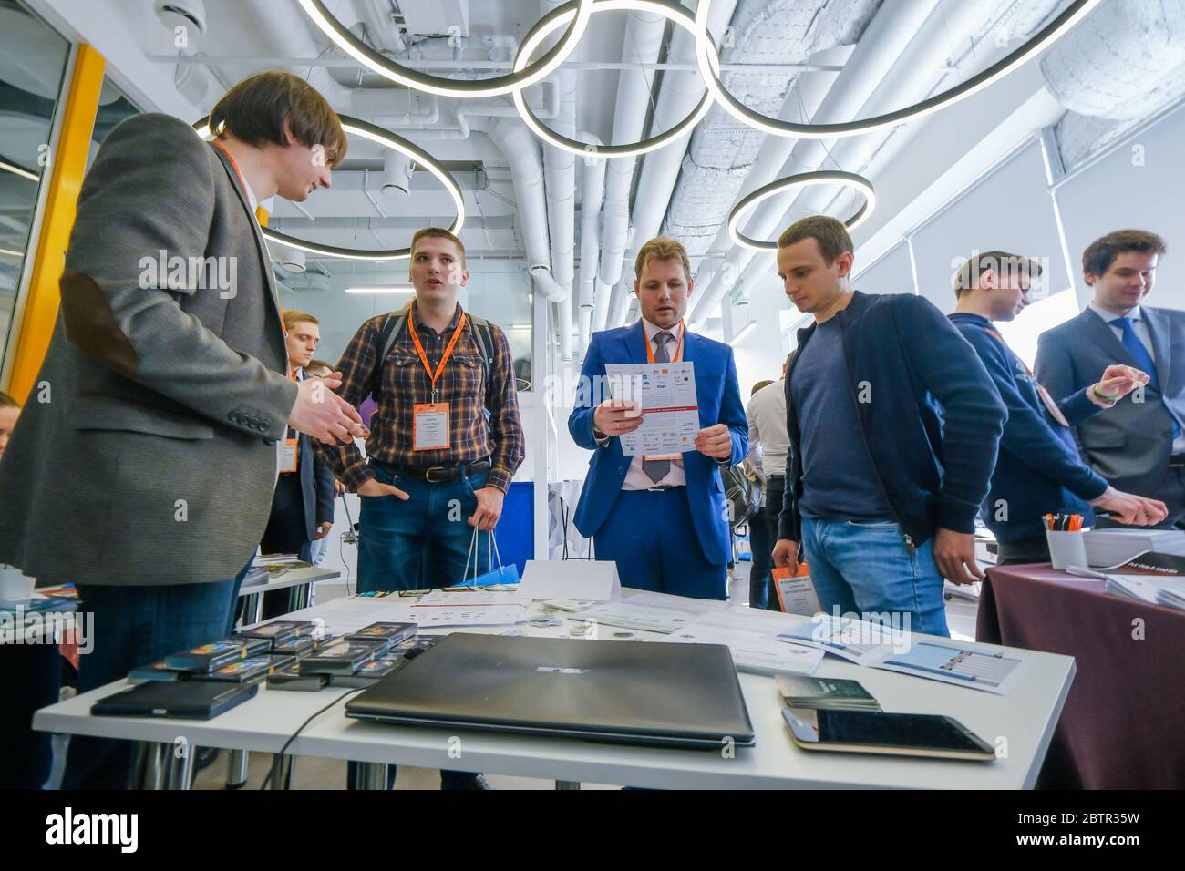 Conference visitors converse at hall Stock Photo - Alamy