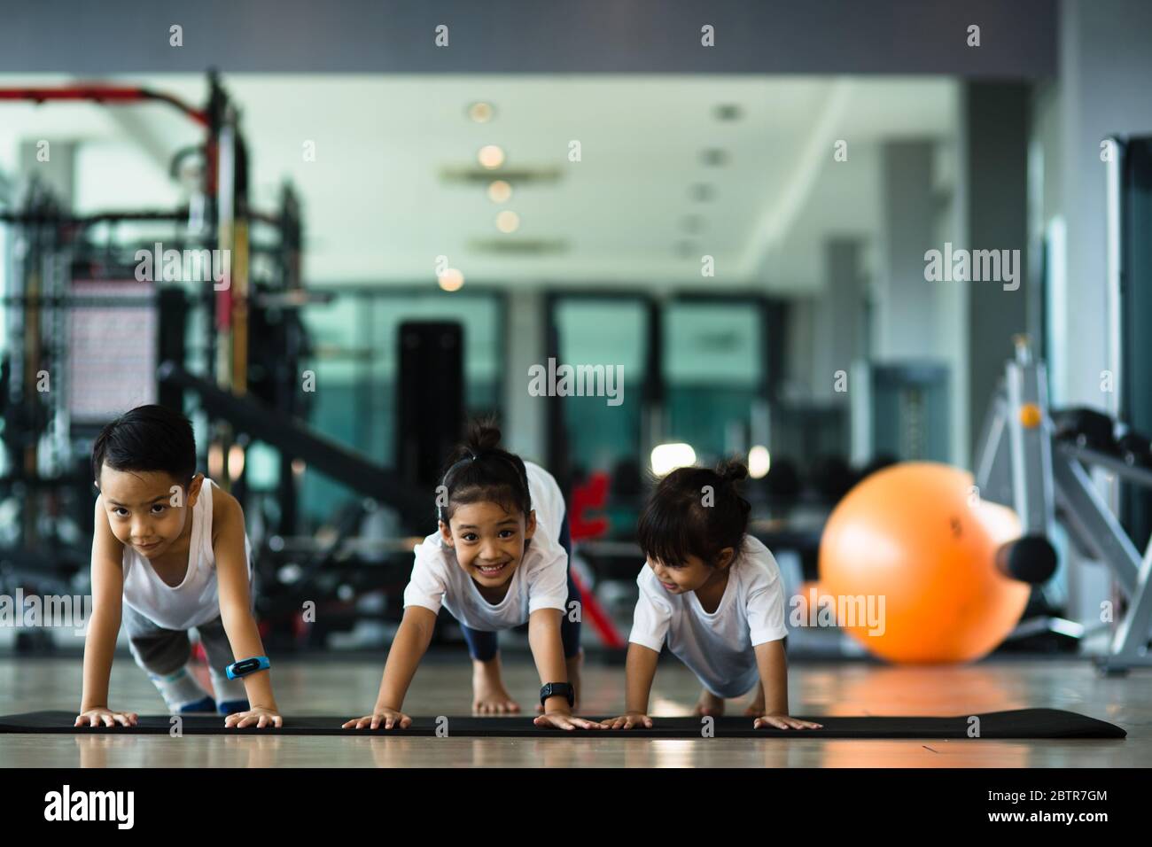 Group of children doing gymnastic exercises Stock Photo - Alamy