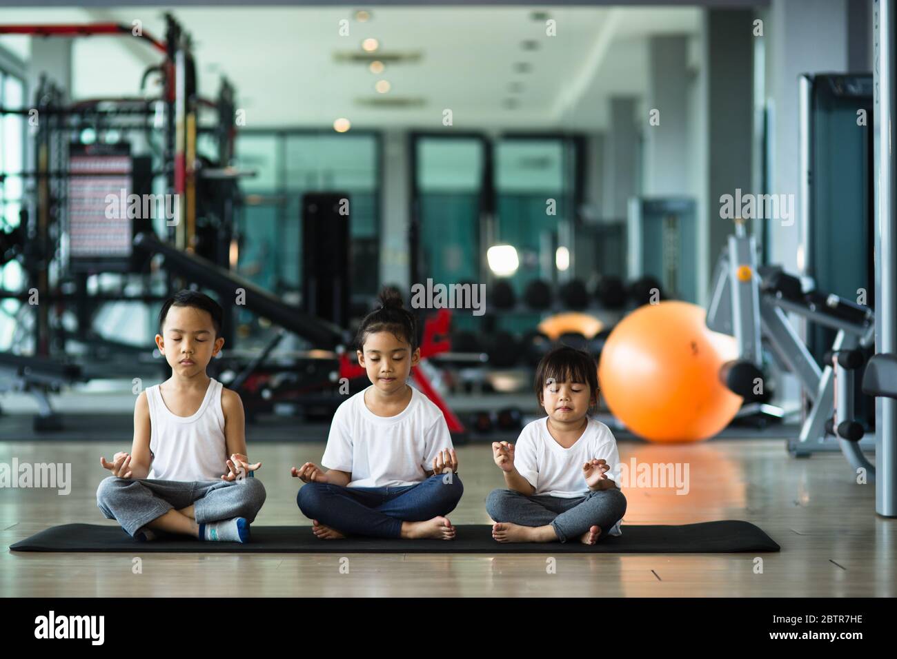 Group of children doing gymnastic exercises Stock Photo - Alamy