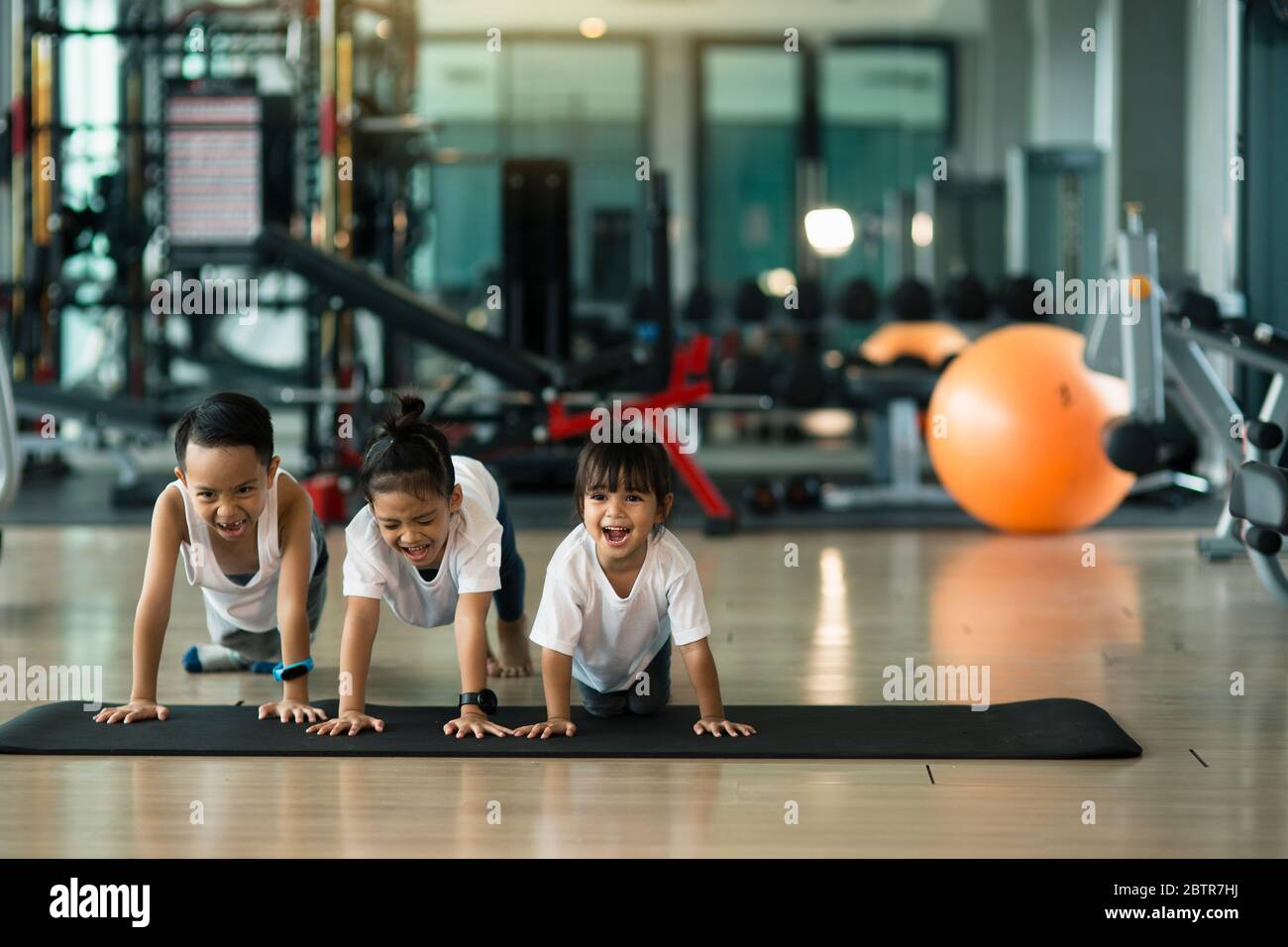 Group of children doing gymnastic exercises Stock Photo - Alamy