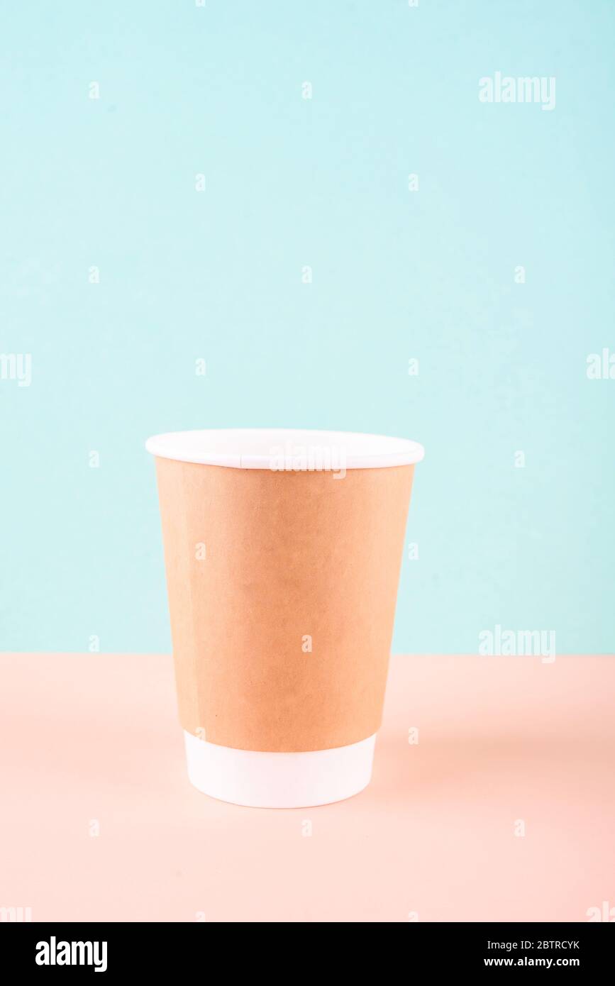 Paper glass with drinking tubes. Eco utensils on a light background ...