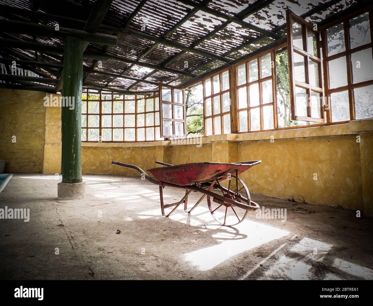 antique red wheelbarrow Stock Photo - Alamy