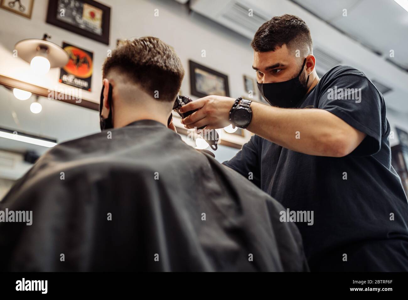Creating a cool haircut and styling in a barbershop Stock Photo - Alamy