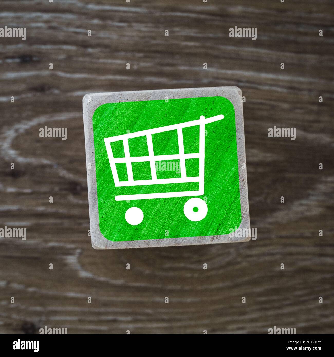 A green shopping cart sign, symbol or icon representing store retail ...