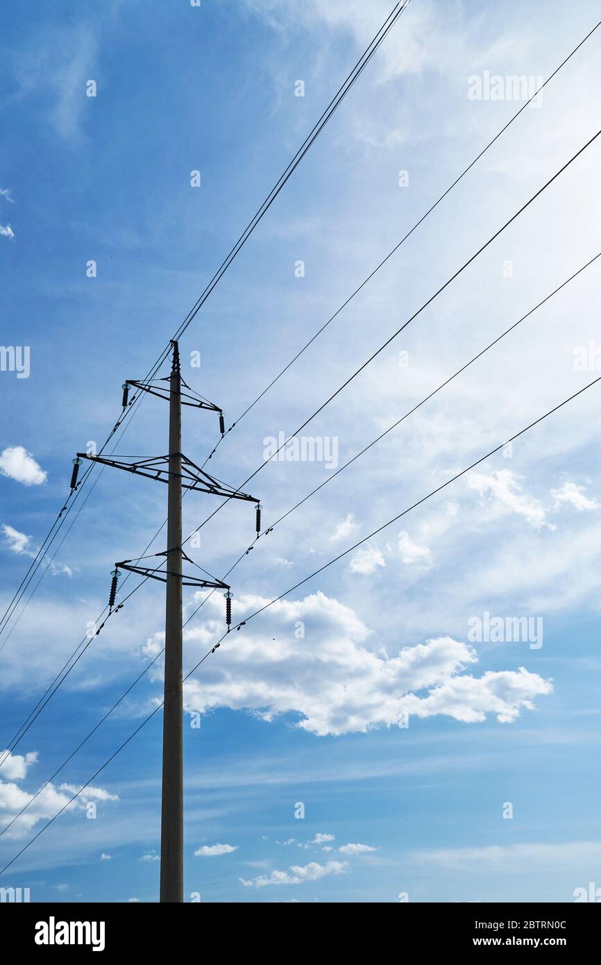 high-voltage electric line against a bright beautiful sky Stock Photo ...