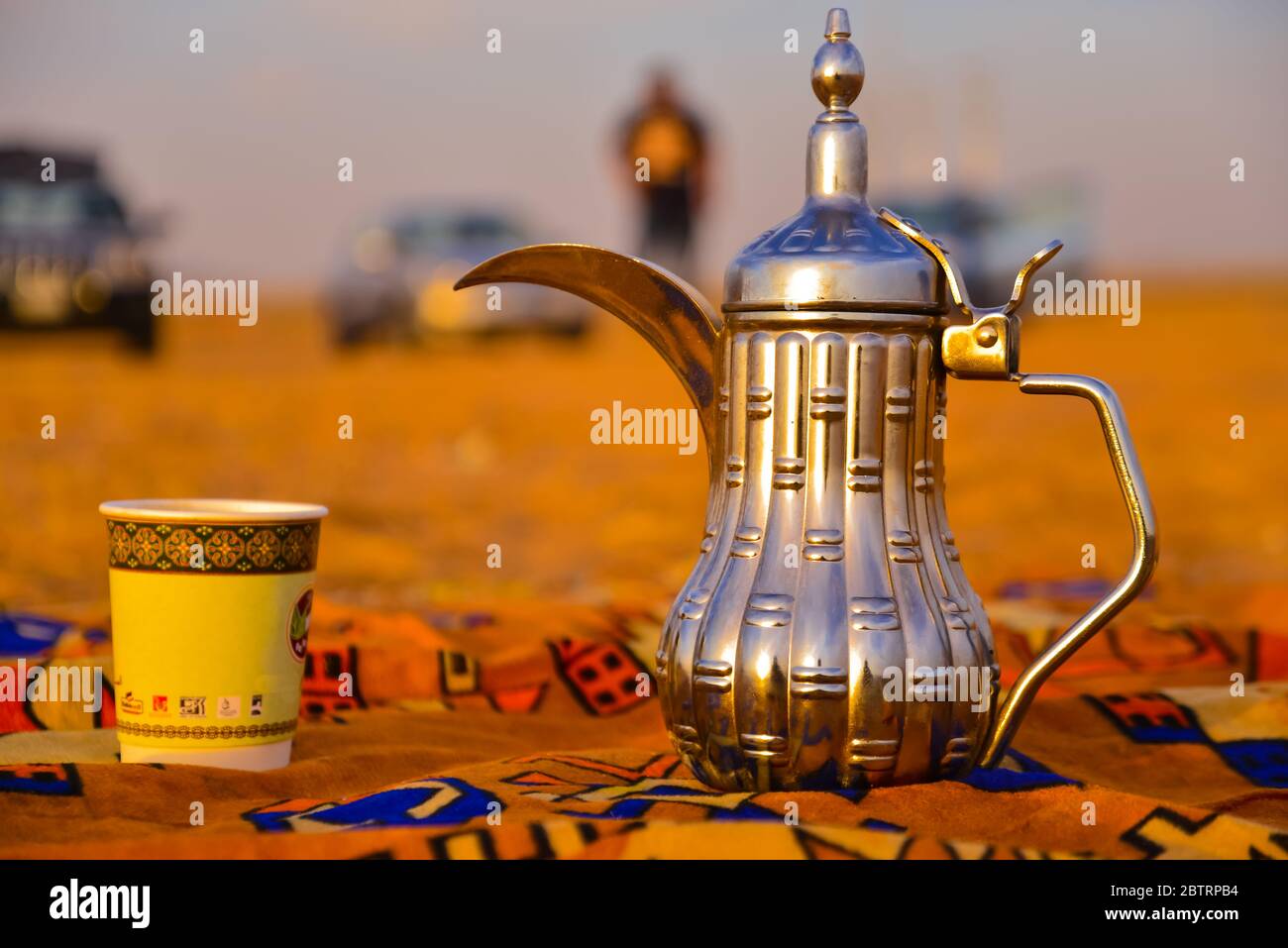 Traditional Arabic Coffee Jar with Cup in dessert Stock Photo - Alamy