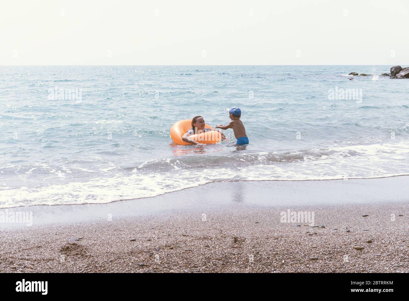 Brother And Sister Swimming Together High Resolution Stock Photography ...