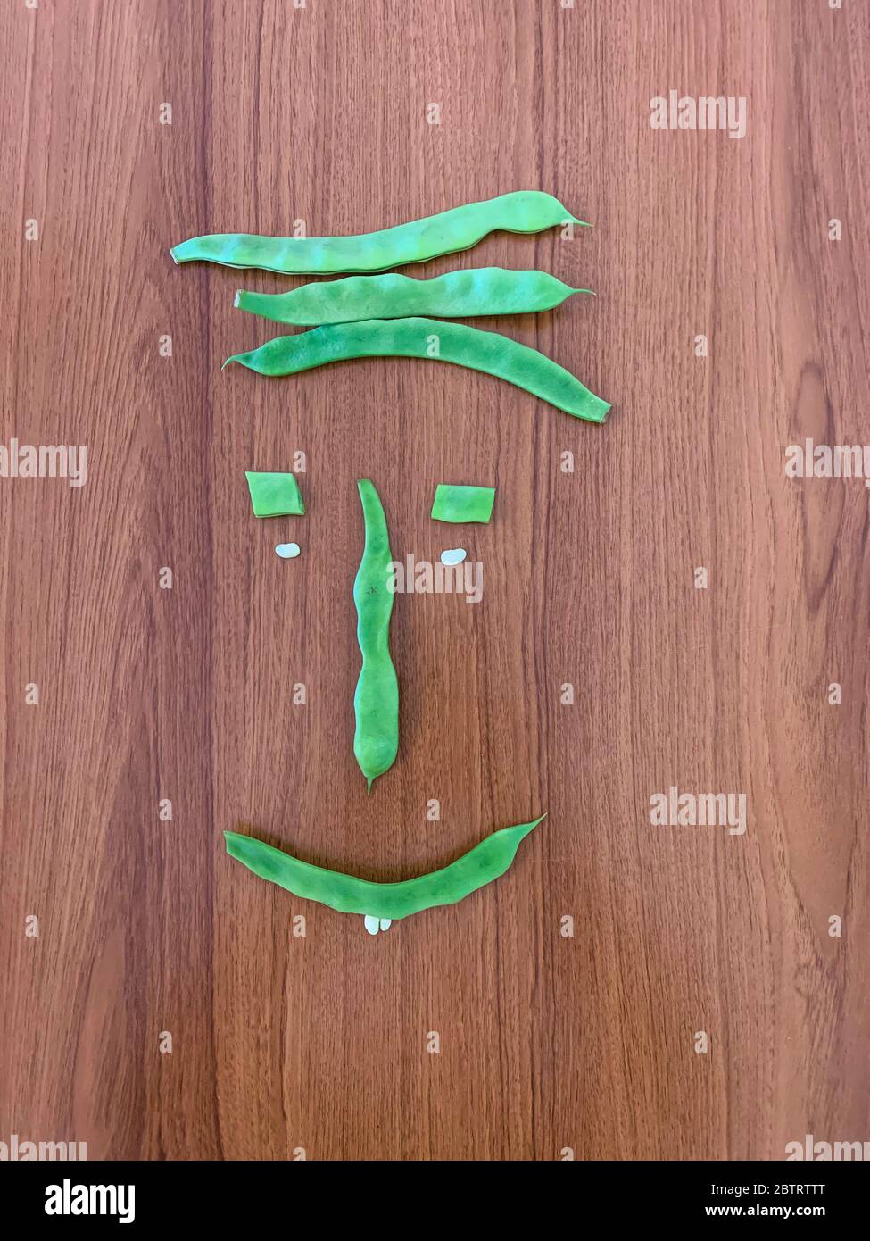 human face made with fresh beans on the kitchen counter in Turkey Stock ...