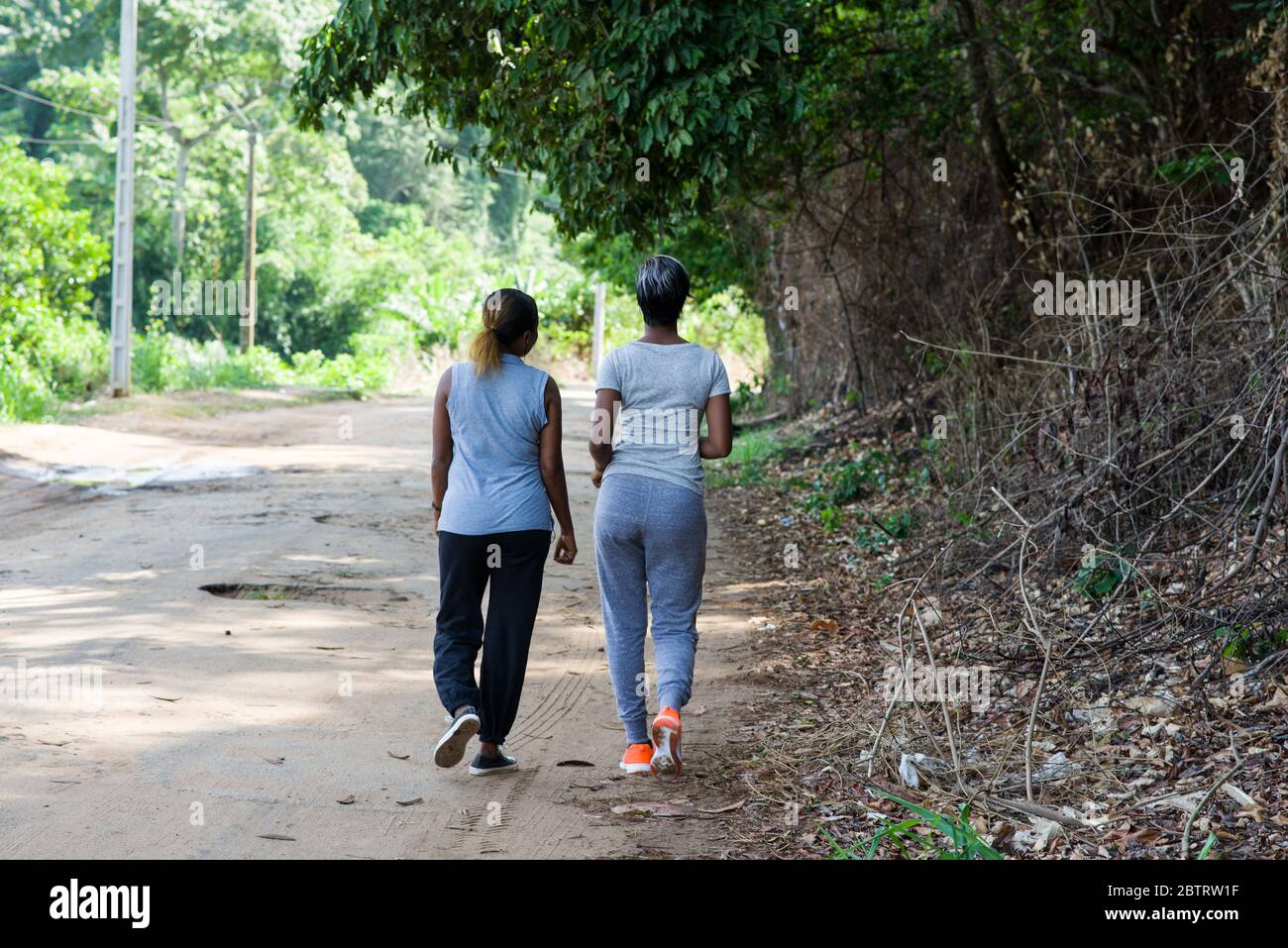 Woman running park backside hi-res stock photography and images - Alamy