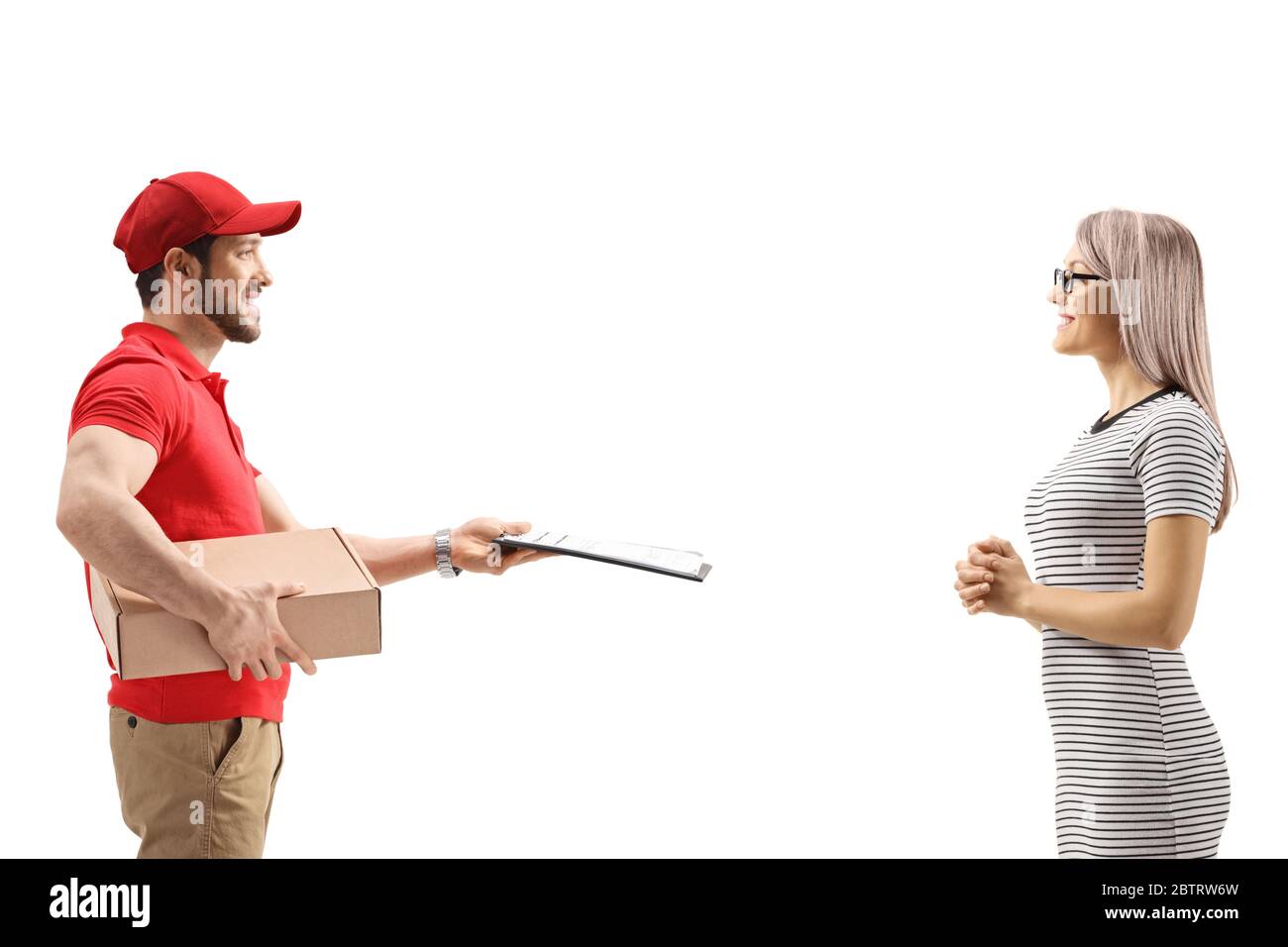 Delivery man handing over a package to a woman isolated on white ...