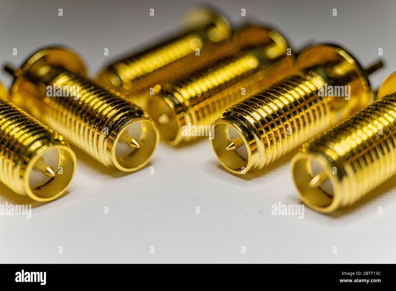 Close-up of symmetric aligned gold plated SMA male connectors ...