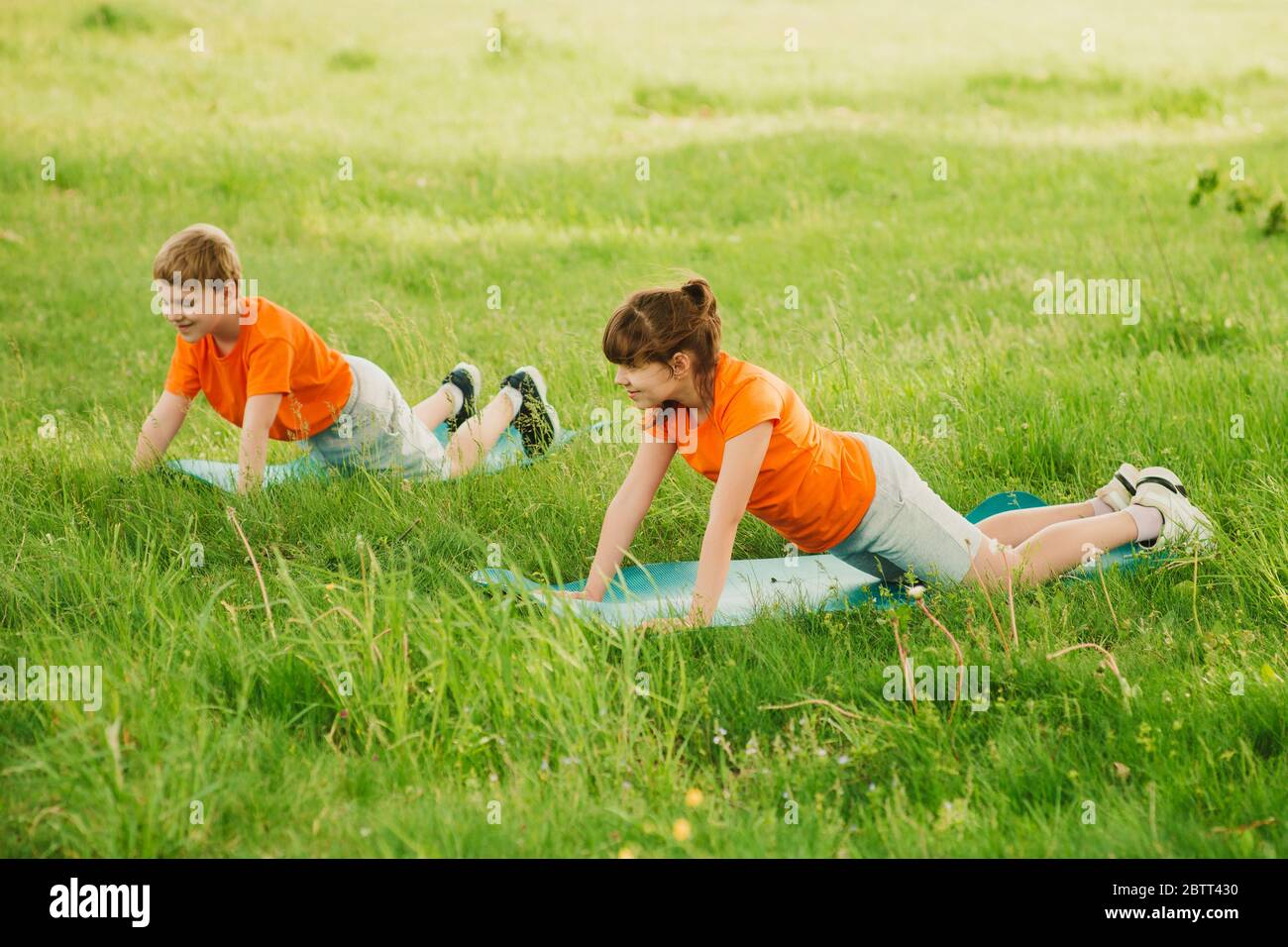 Children yoga outdoors hi-res stock photography and images - Alamy